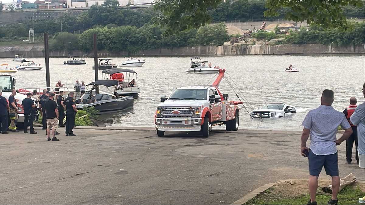Pickup truck slips into the Mon River