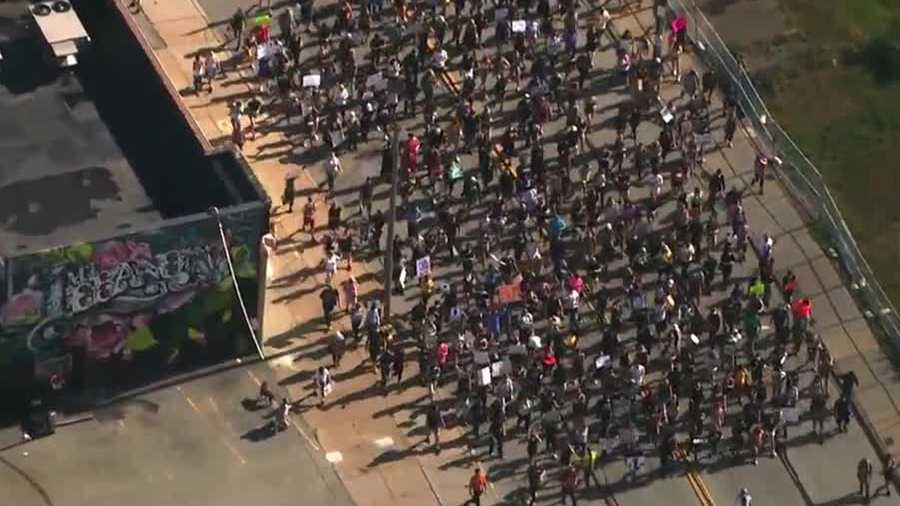 Protesters walking through Mt. Lebanon business district