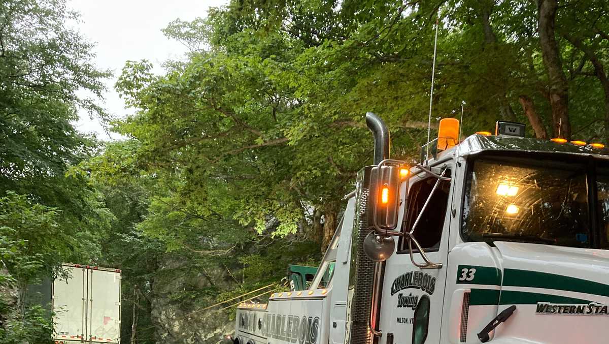 Trapped tractor-trailer backs up traffic on the notch road