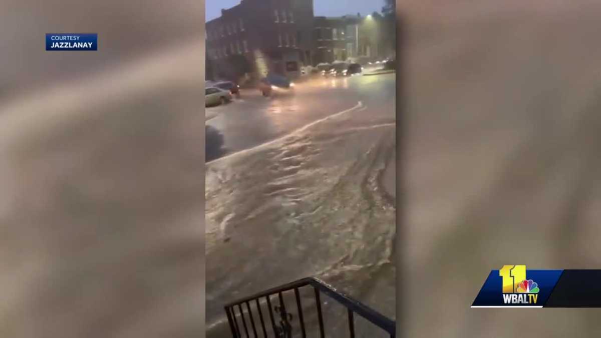 Residents clean up in Baltimore after downpours brought flooding