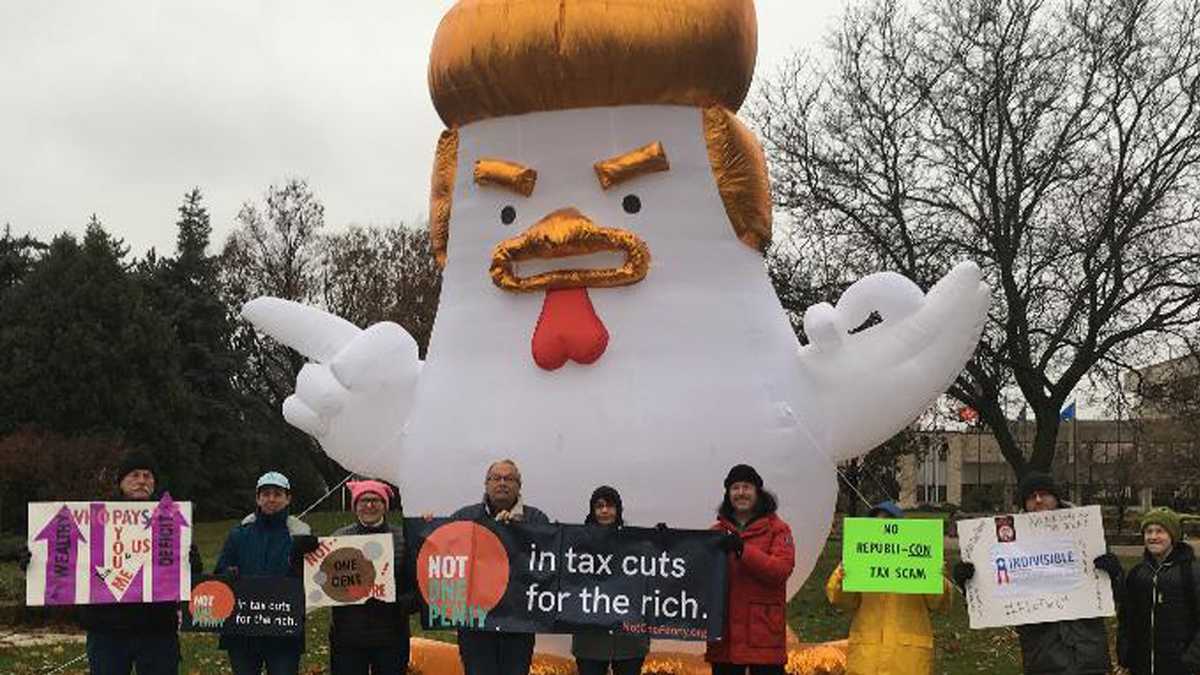 Protestors of GOP tax plan bring message, inflatable Trump chicken to ...