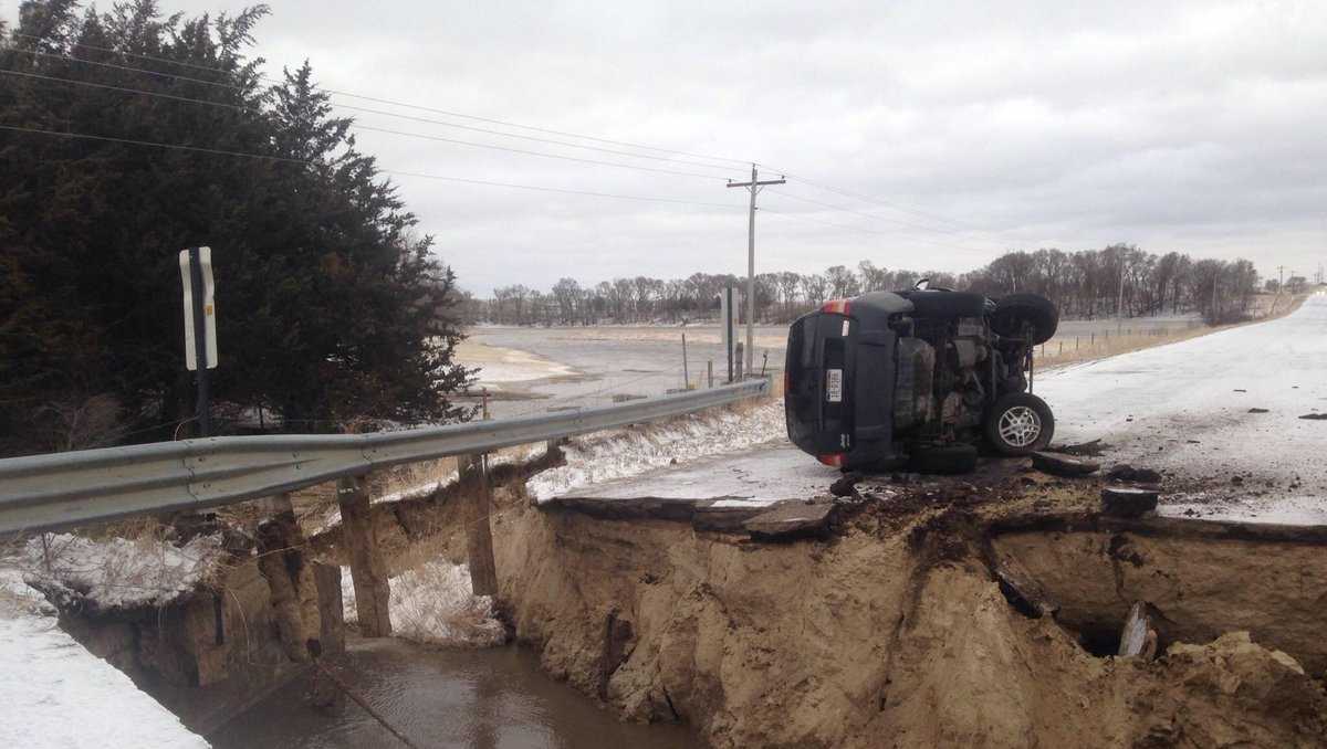 Flooding aftermath: damage to homes, roads