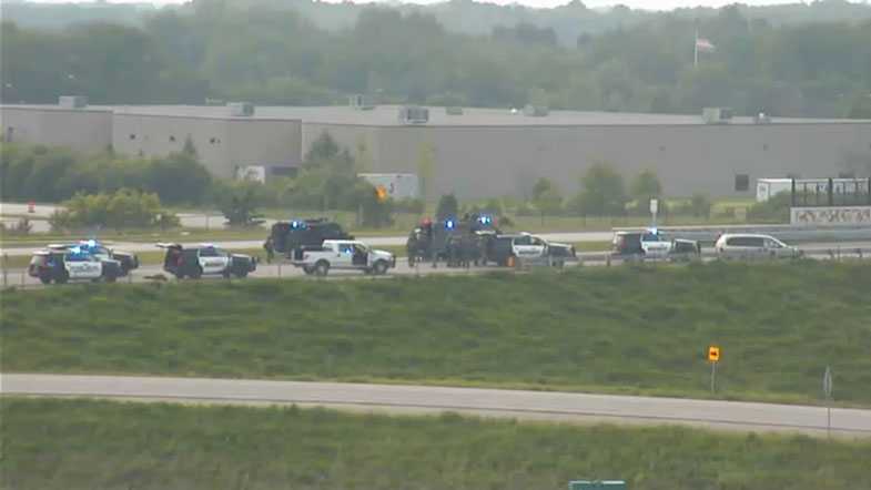 Two officer-involved shootings part of Swat standoff, freeway closure