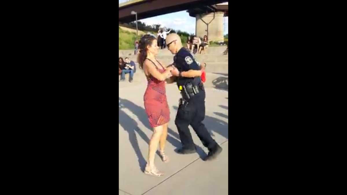 Officer shows off salsa skills at Waterfront Dancing event