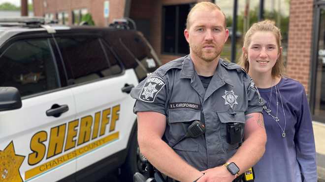 Officer, wife save woman in distress on I-95 in Baltimore