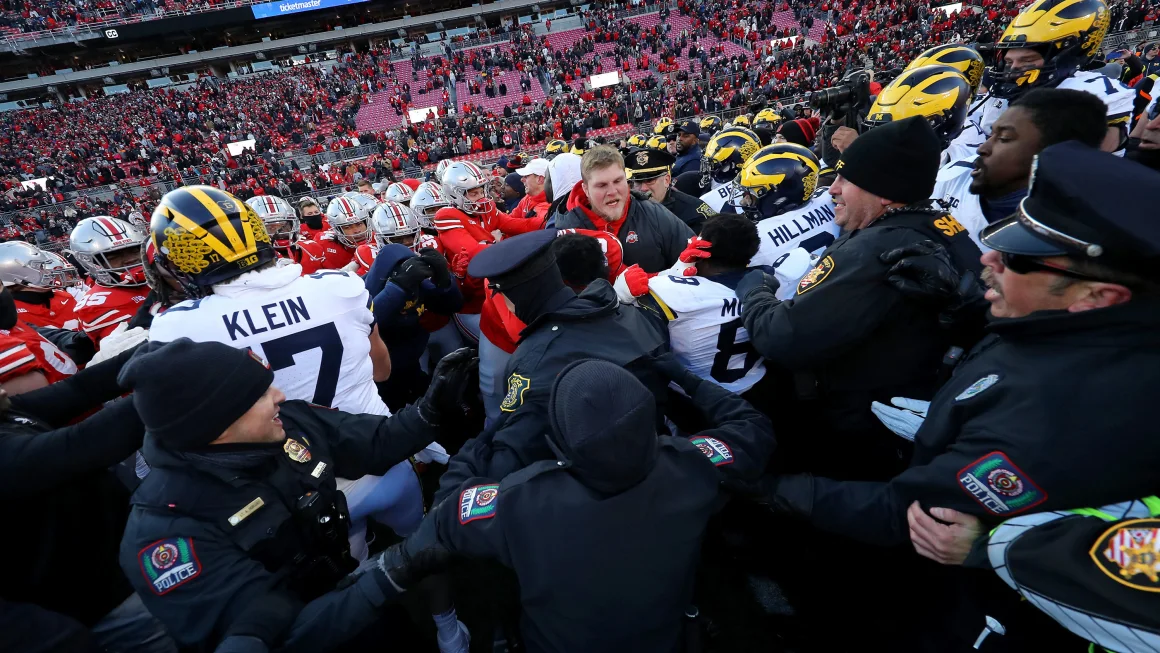 Brawl ensues after Michigan deals stunning upset loss to rival Ohio State