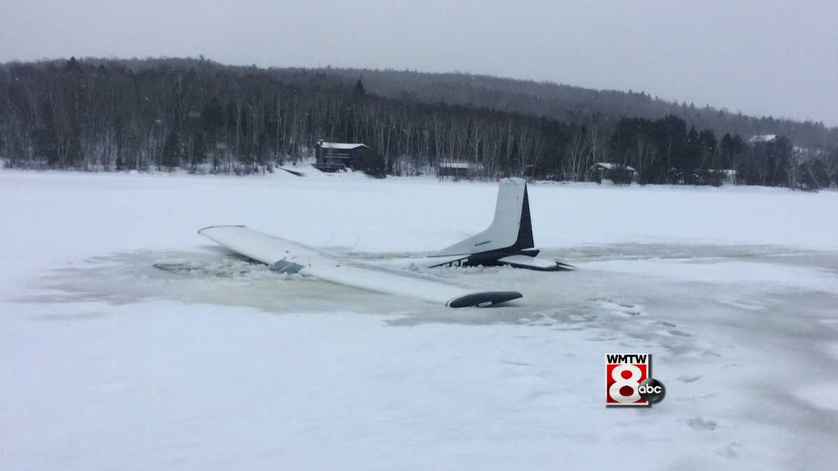 Maine warden's plane lands on lake, breaks through ice