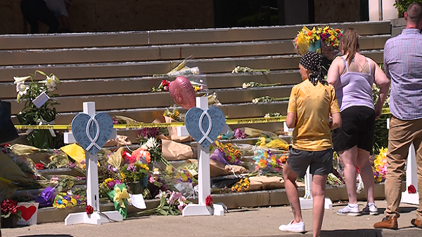 Louisville residents shocked by mass shooting grieve during vigil
