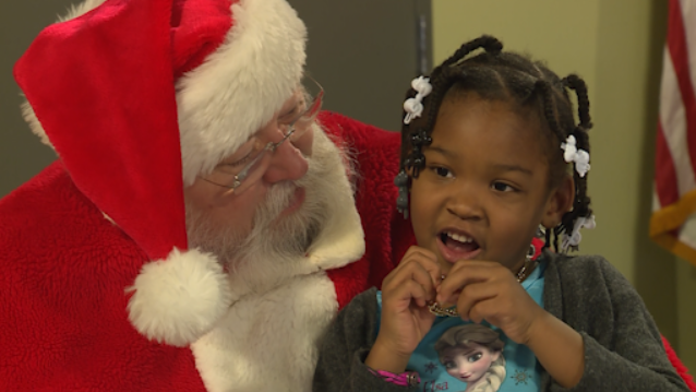 Santa visits Open Door Mission to hand out stockings