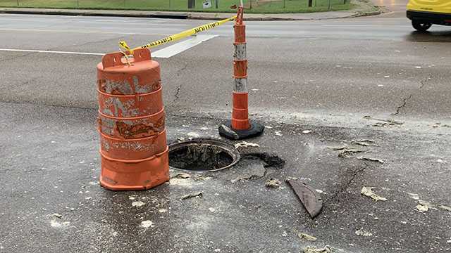 Open manhole spewing sewage damages SUV