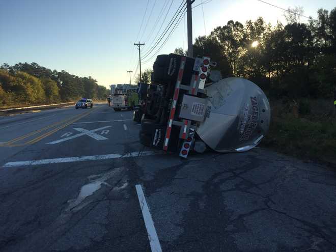 Overturned tanker blocks lanes, injuries reported, officials say
