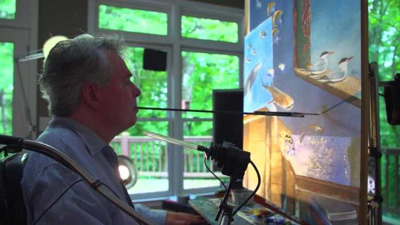 Paralyzed artist finds success after learning to paint with his mouth