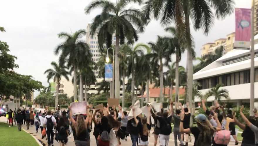 Peaceful protesters march through West Palm Beach