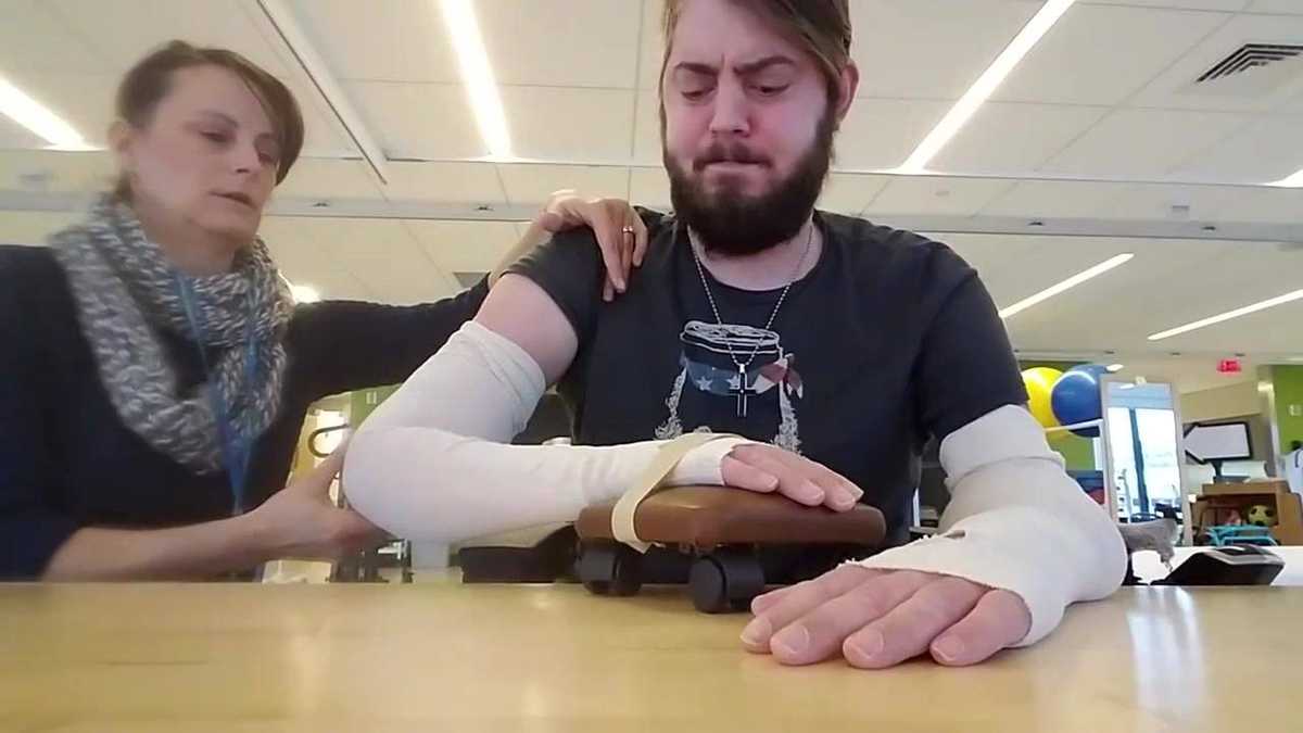Double arm transplant patient John Peck shows off his progress