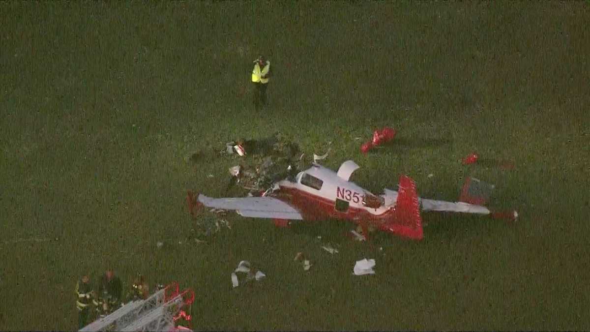 Small plane crashes at end of Mass. airport runway