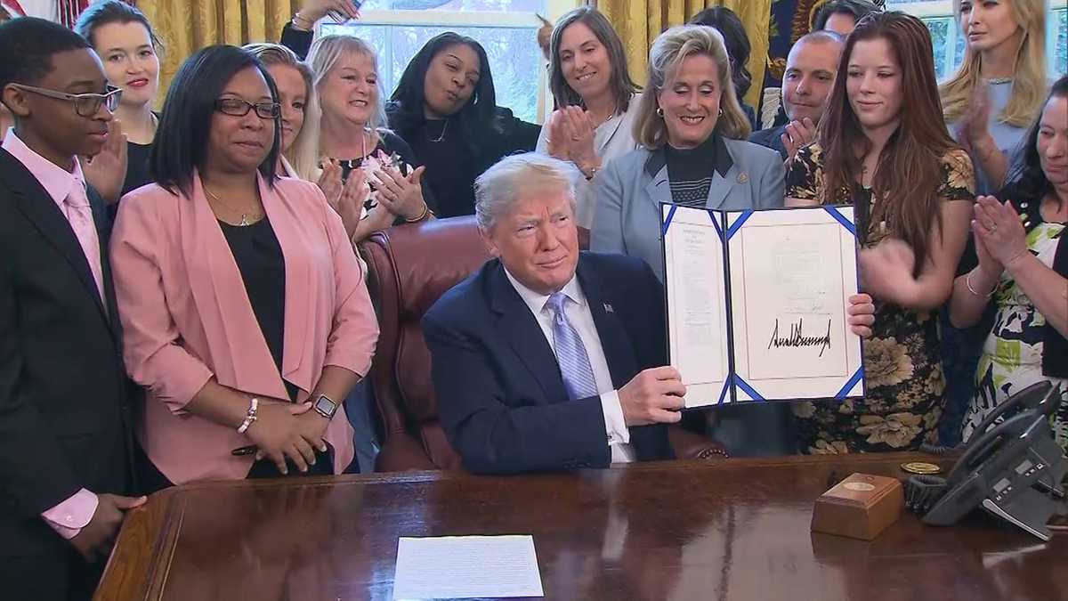 Woman dances through bill signing in oval office