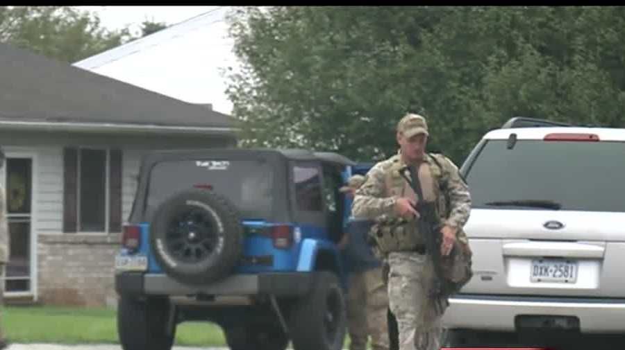 Suspect set fire to home during standoff, police say