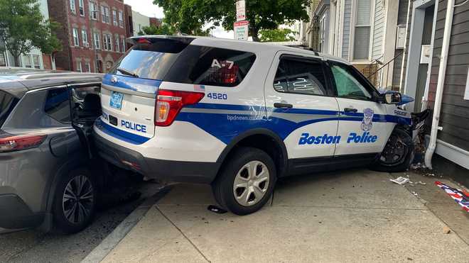 Boston PD cruiser crashes into building that houses barbershop