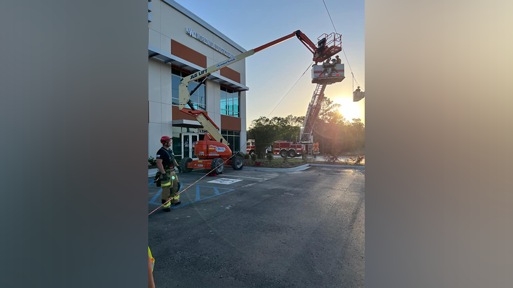 Georgia firefighters rescue workers trapped by power lines