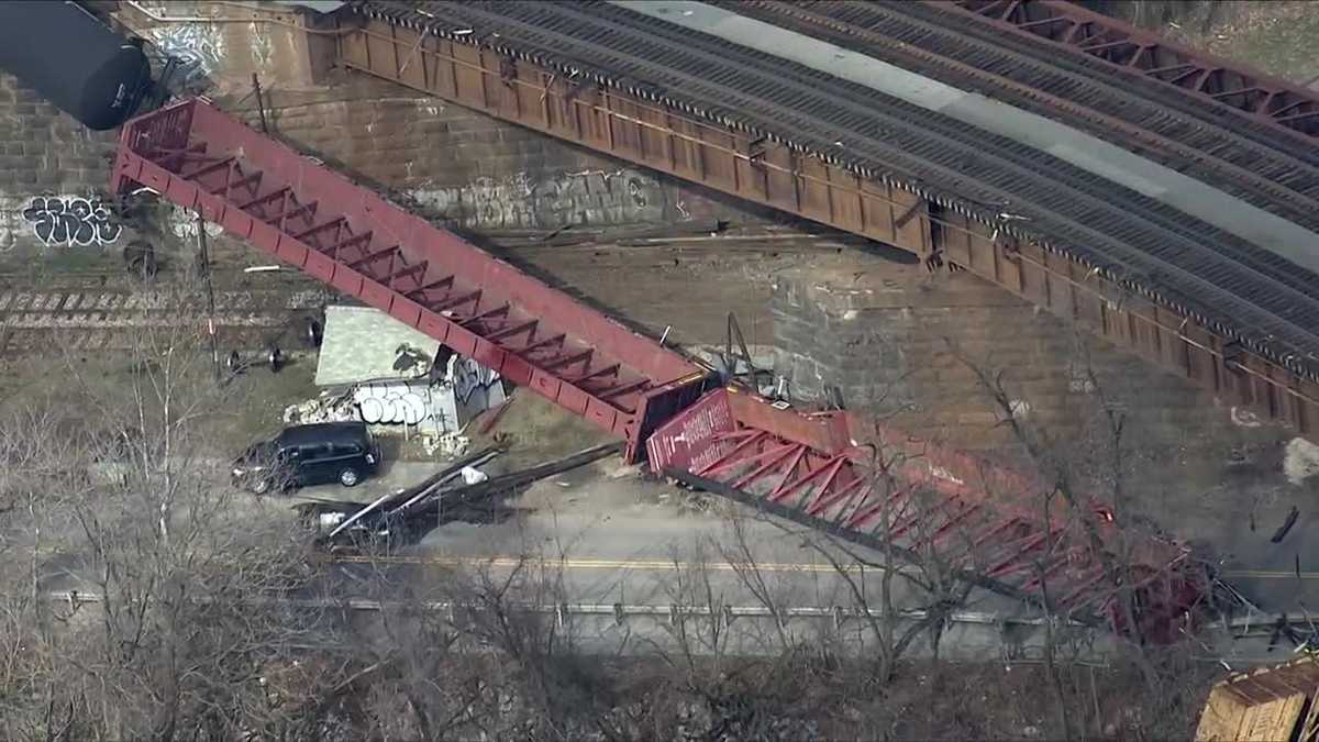 Photos: Freight train derails on bridge in north Baltimore