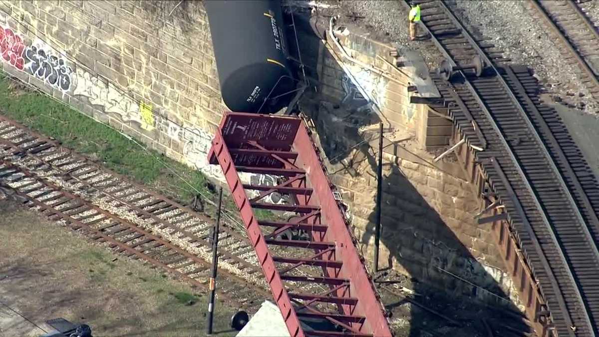 Photos: Freight train derails on bridge in north Baltimore