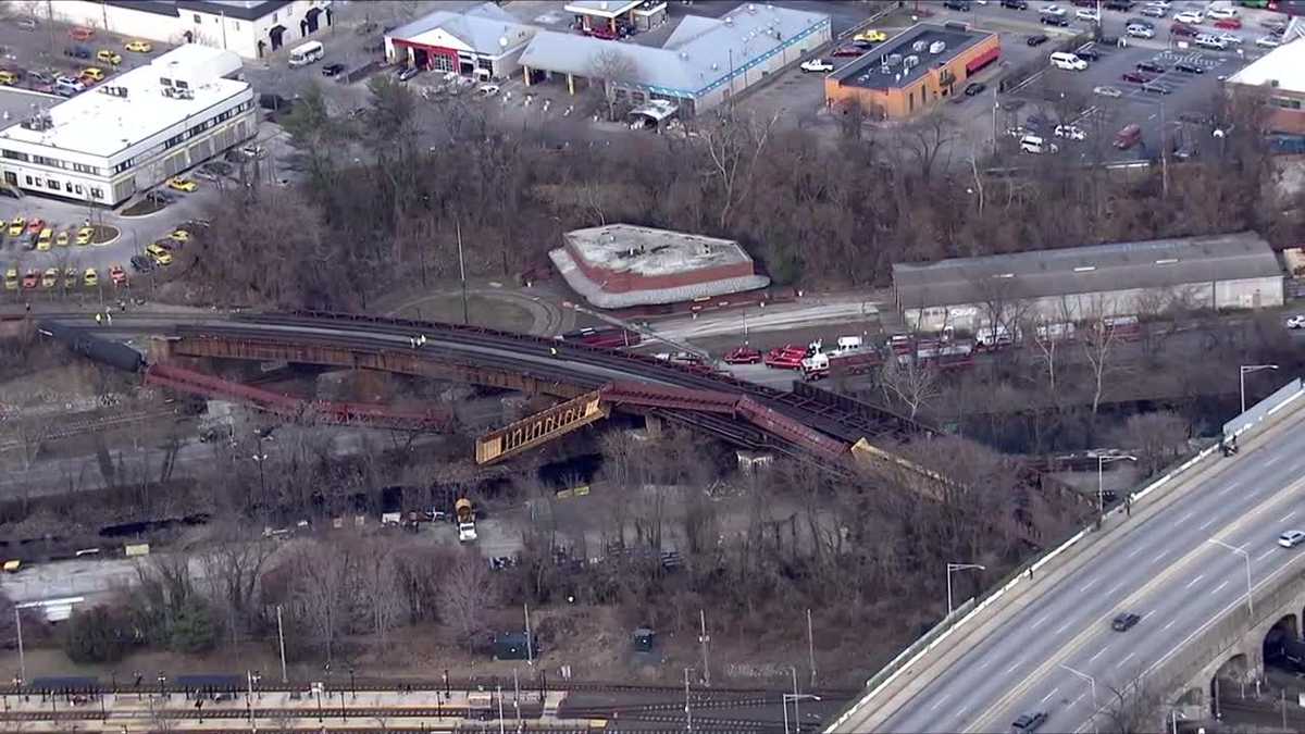 Photos: Freight train derails on bridge in north Baltimore