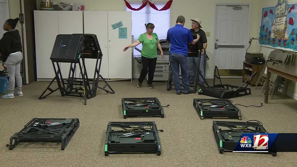 Volunteers work hard to set up polling sites ahead of Election Day