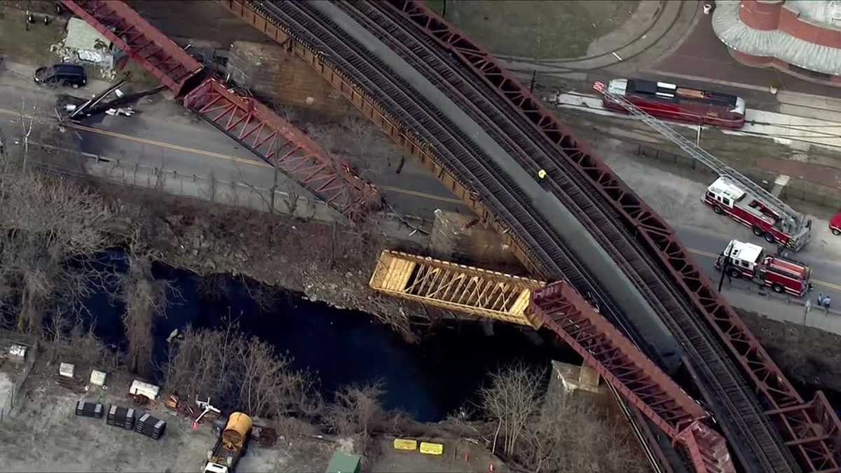 Photos: Freight train derails on bridge in north Baltimore