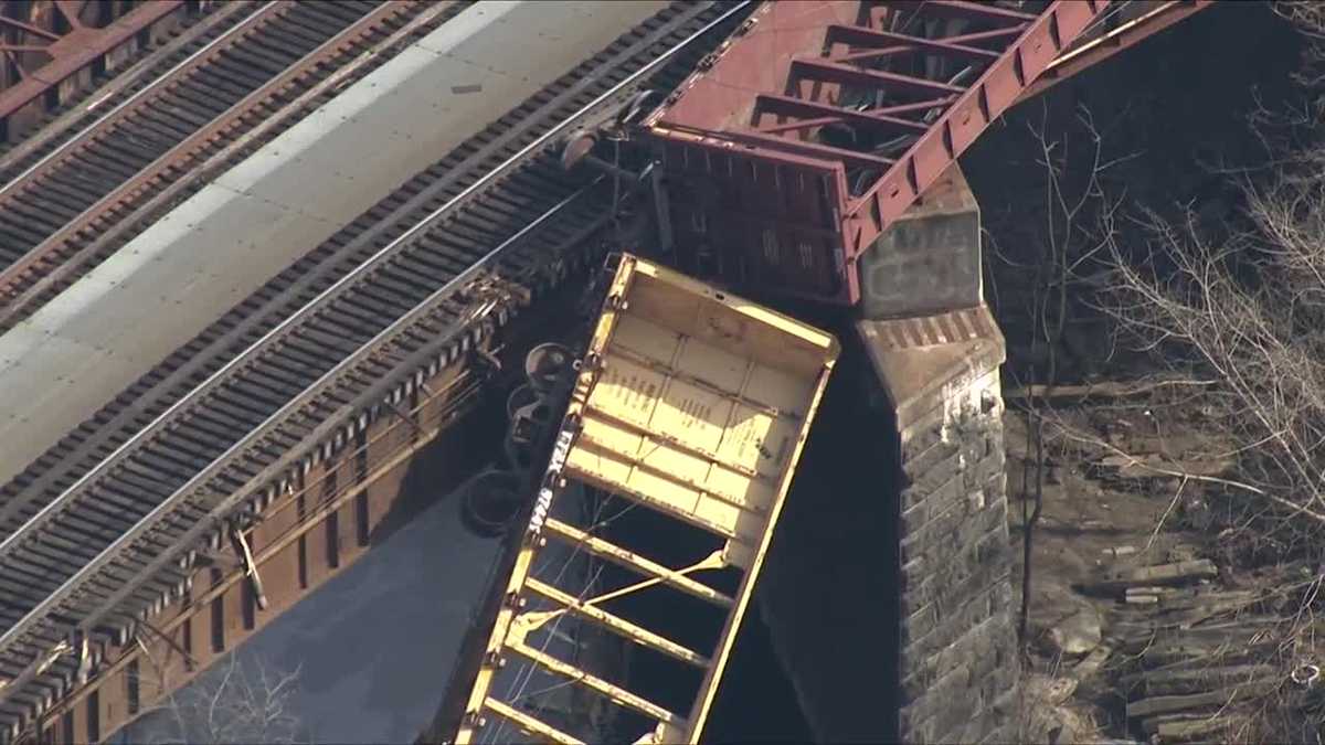 Photos: Freight train derails on bridge in north Baltimore