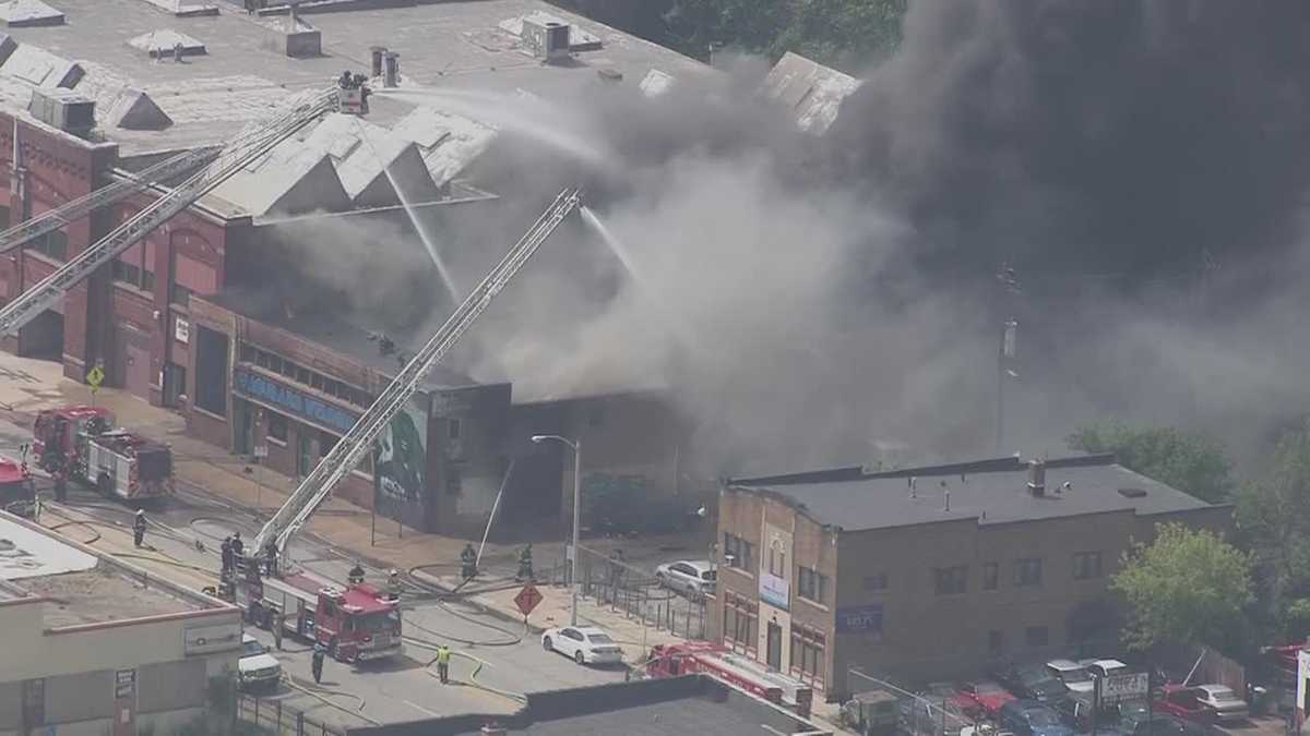 Firefighters endure oppressive heat, humidity to battle business fire