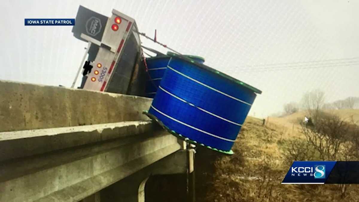 Two-vehicle crash leaves 11,000 pounds of wire dangling from bridge