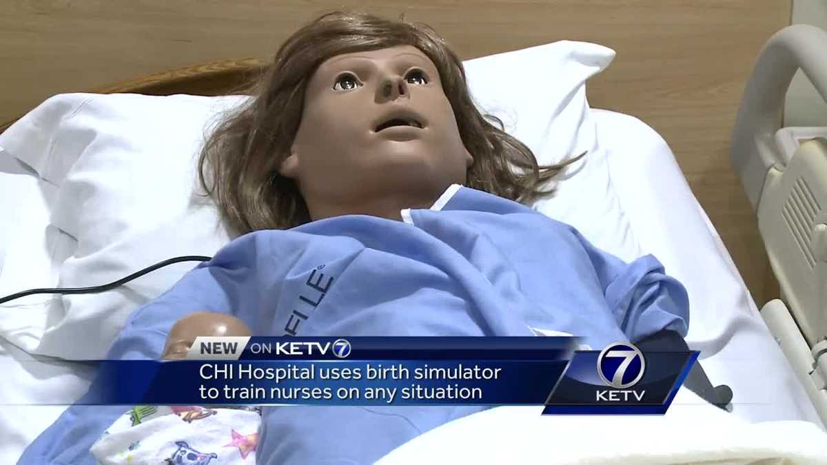 Nurses prepare for delivery with birth simulation mannequin