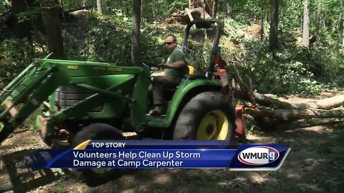 Volunteers help clean up storm damage at Camp Carpenter on opening day