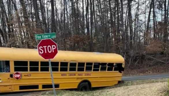 North Carolina school bus gets stuck in ditch