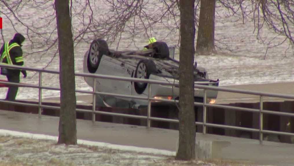 Accused drunken driver crashes, car dangles over Lake Michigan