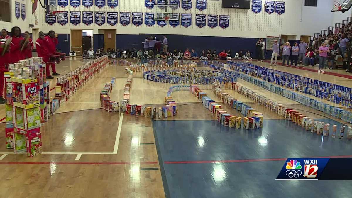 2,915 food boxes create giant dominoes at Clemmons Middle School