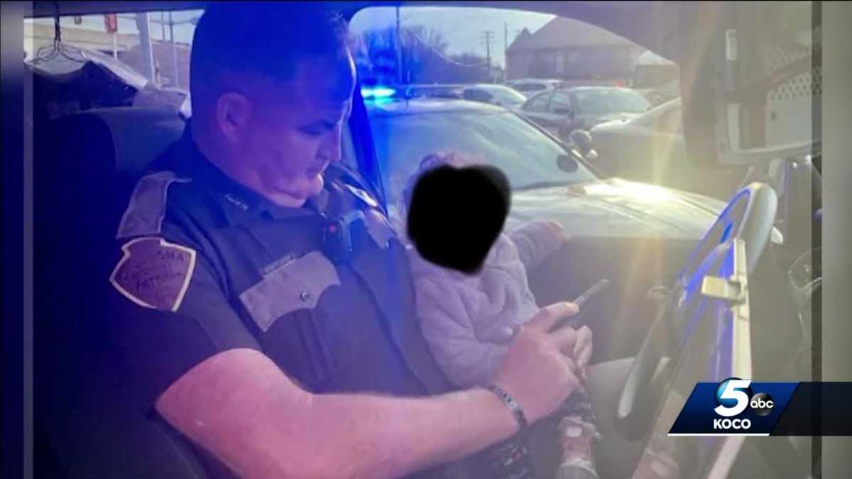 CHILD COMFORTED: State trooper consoles child after car chase