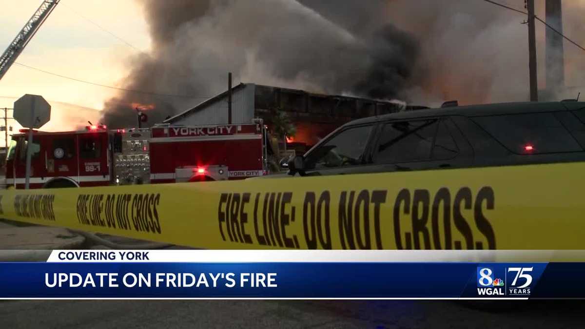 Firefighters blast hot spots after six-alarm warehouse fire