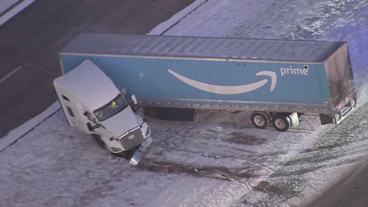 Slick Oklahoma roads cause Amazon semi-trailer to slide off I-35