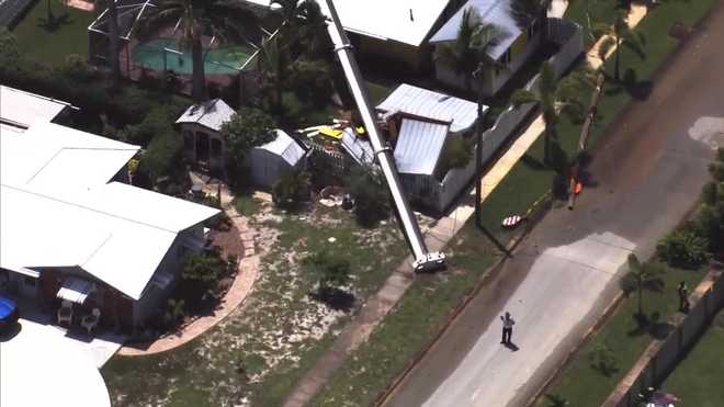 Crane falls on Florida home