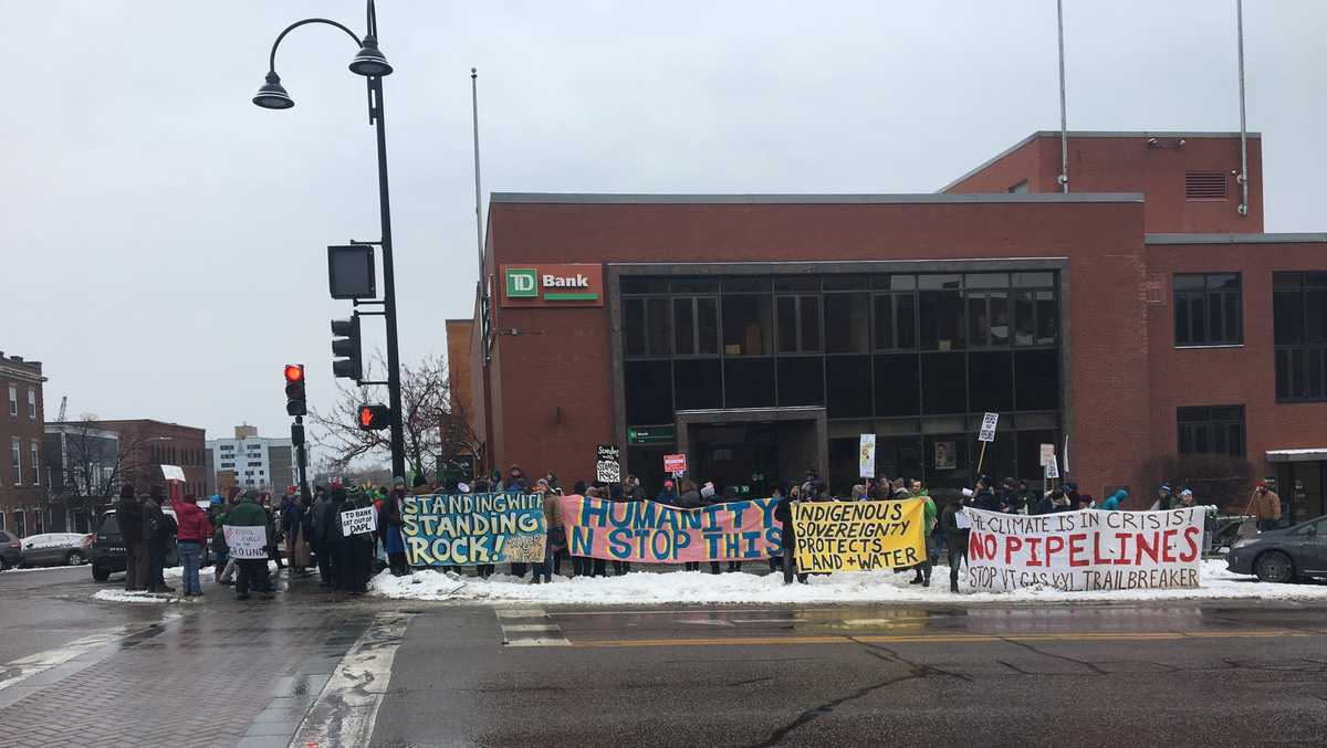 Dozens gather outside Burlington's TD Bank to protest pipeline