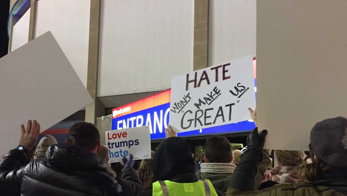 Protesters chant, hold signs outside arena as Trump visits Cincinnati