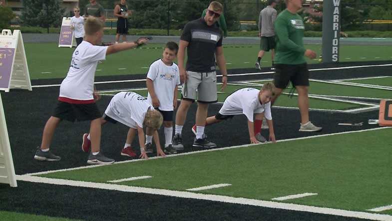 Kids punt, pass, kick to help other kids with cancer