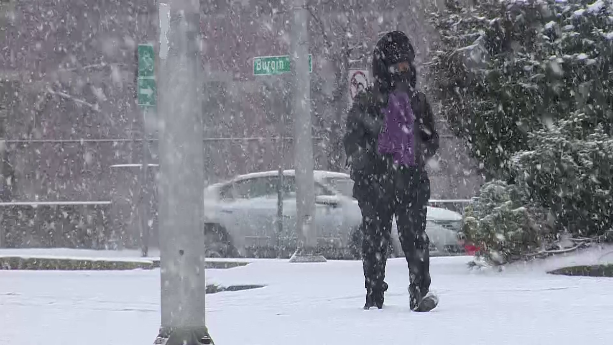 Snow showers linger; Watch out for slick spots