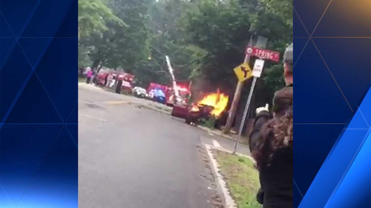 Woman rescued from burning vehicle after crash