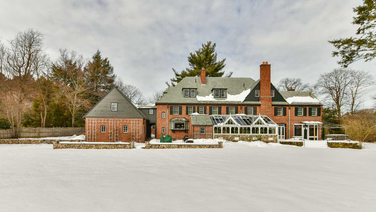 $4.85M stately brick colonial has conservatory, superb gym