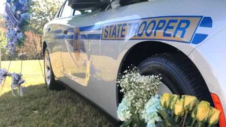 Community visits memorial set up for fallen trooper Daniel Rebman.
