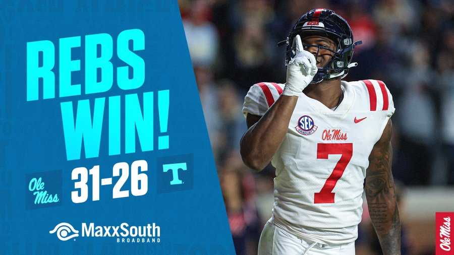 Rebels hold on for 31-26 win over Tennessee in a wild game on the road