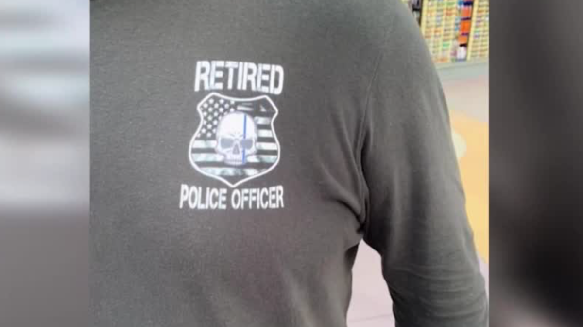 Retired officer says he was hassled over shirt at Universal