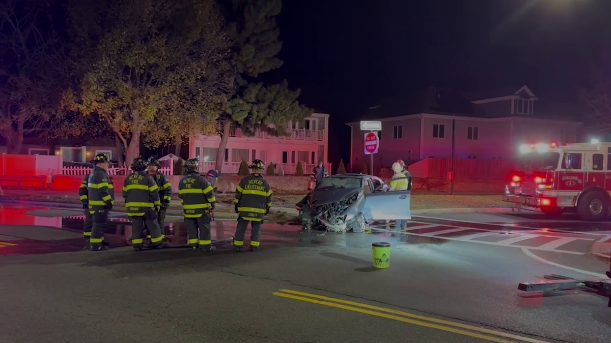 Neighbors rescue driver from burning car after crash in Revere